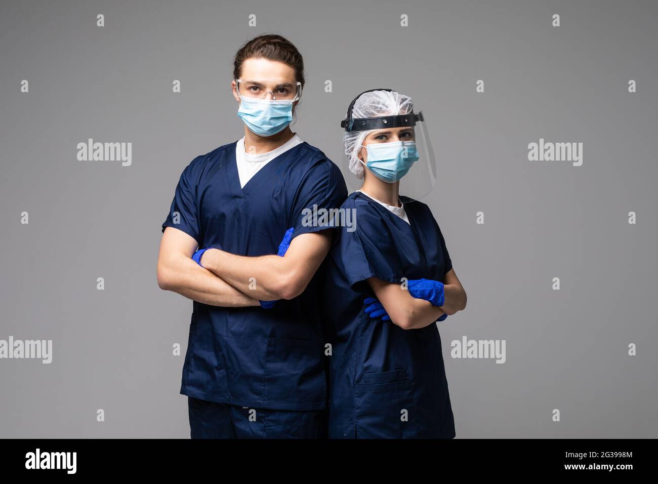 Photo of two specialists experienced doctors arms folded wear ...