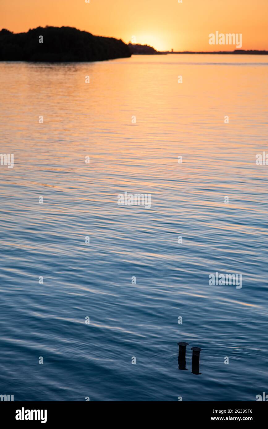 Beautiful vertical wallpaper of tranquil water at sunset Stock Photo ...