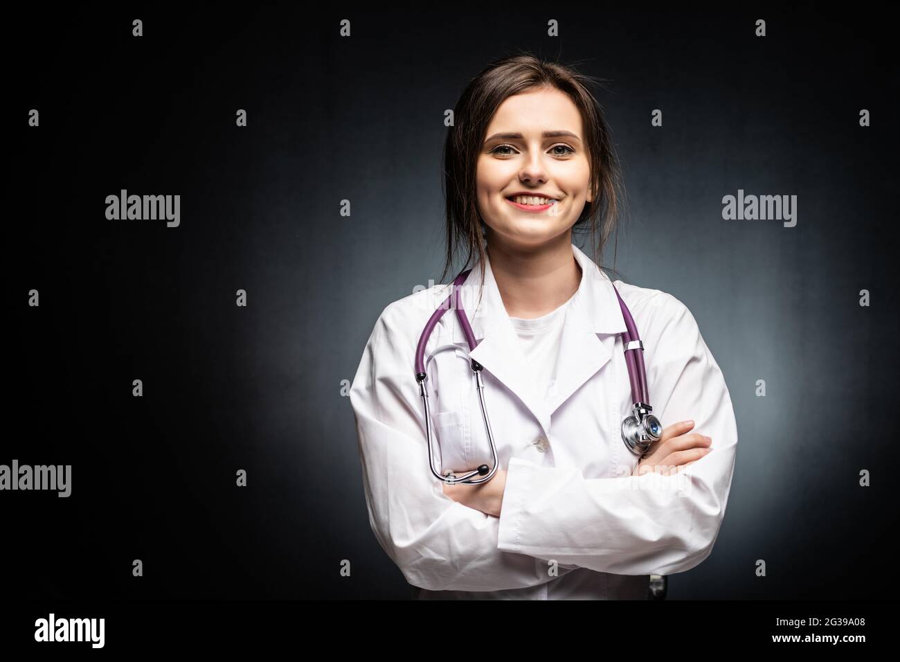 Full length portrait of serious doctor woman on black background Stock ...
