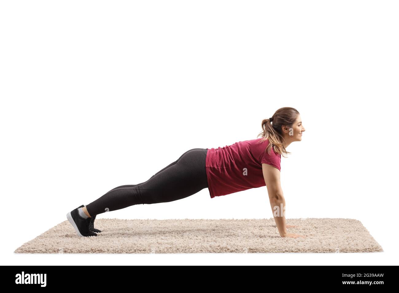 Young woman exercising plank exercise isolated on white background ...