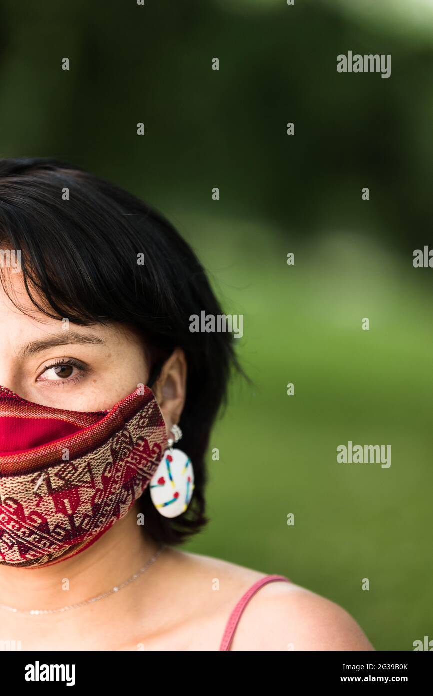Latin America Bolivian woman with traditional pattern cloth mask ...