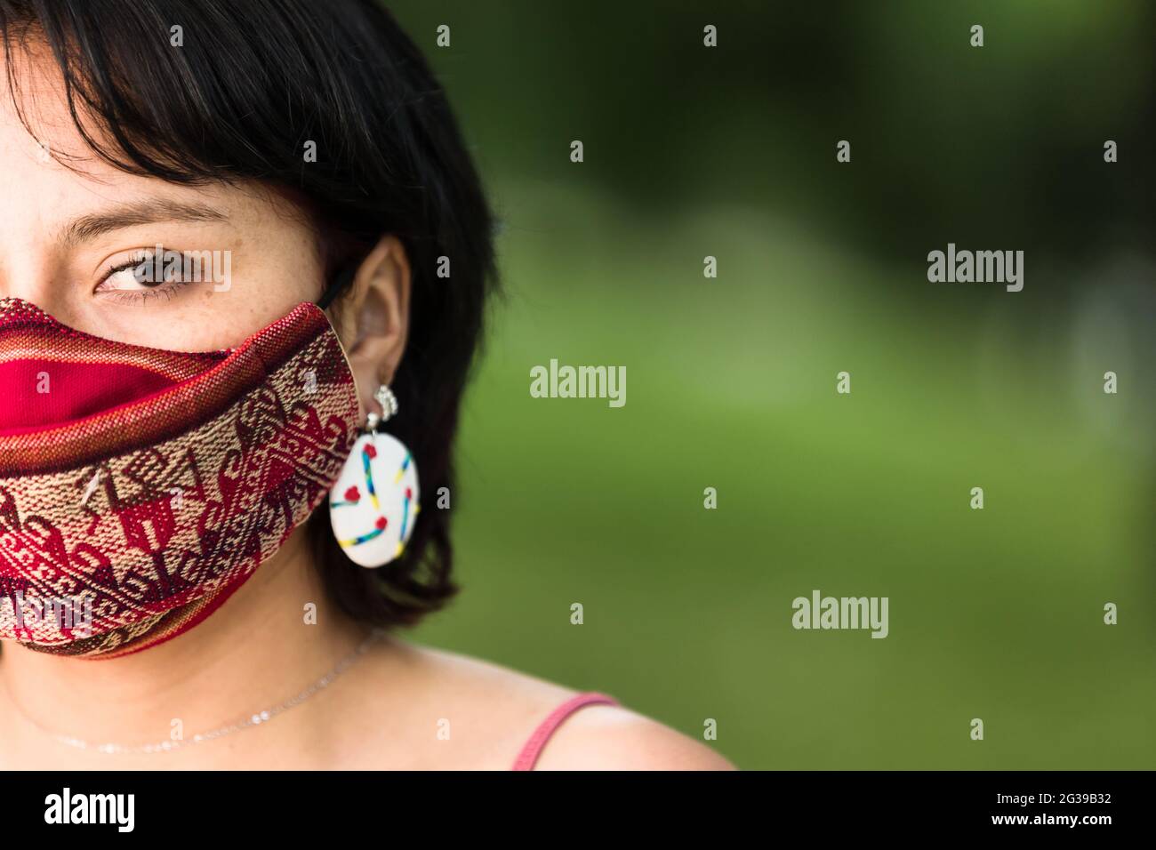 Latin America Bolivian woman with traditional pattern cloth mask ...