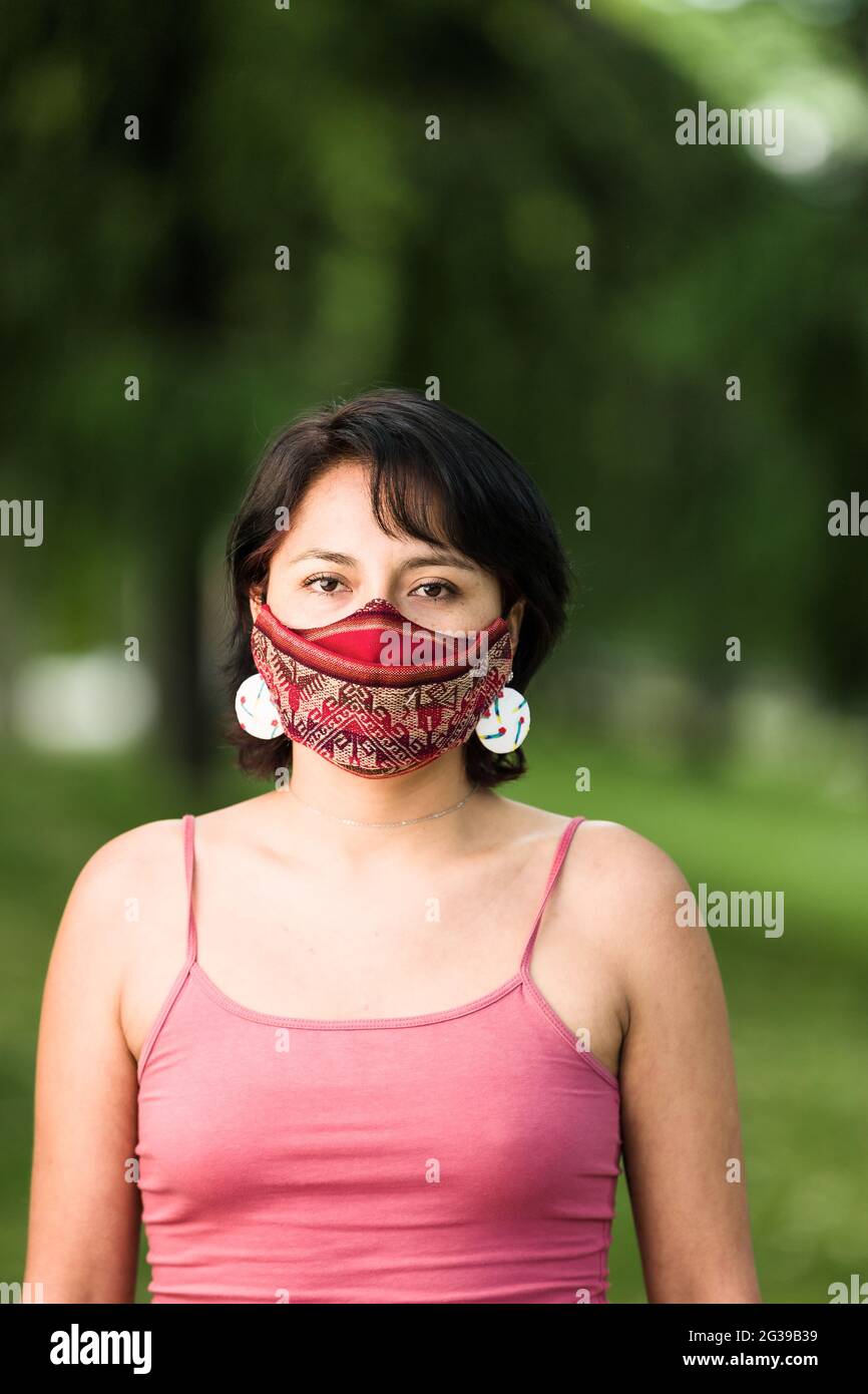 Latin America Bolivian woman with traditional pattern cloth mask ...