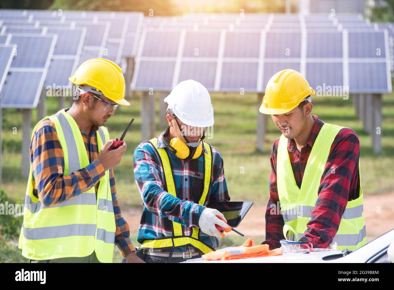 Group of engineers meeting on building roof solar Stock Photo - Alamy