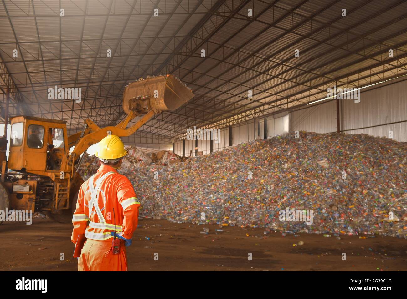 workers in recycling factory,engineers standing in recycling center ...