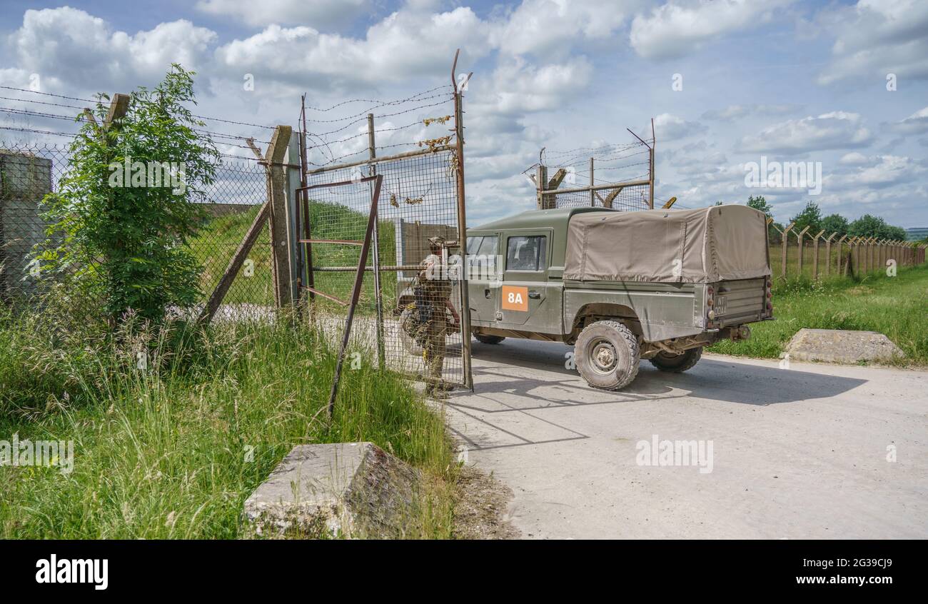 a British Army Land Rover Defender returning to the security of the ...