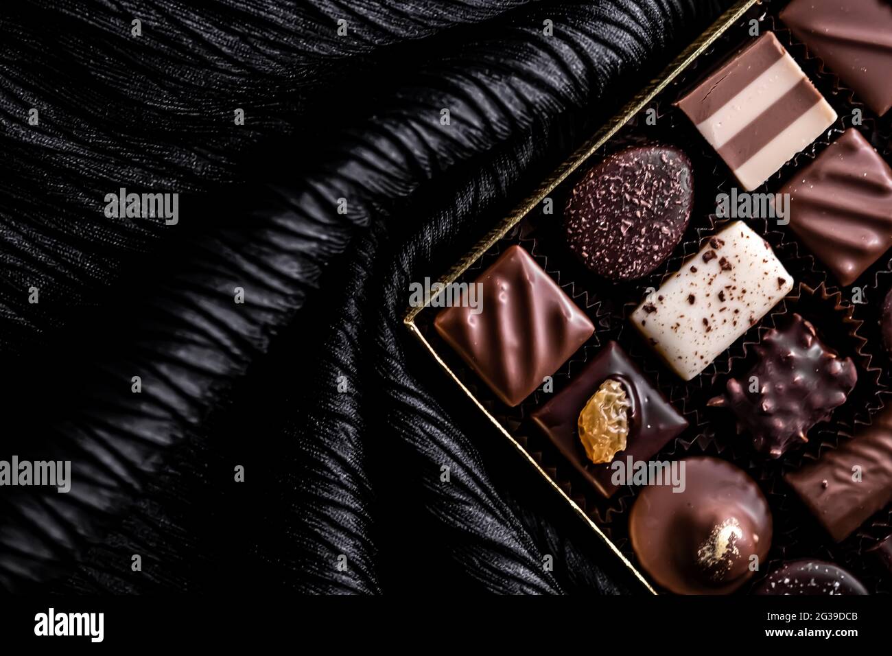 Swiss chocolates in gift box, various luxury pralines made of dark and ...