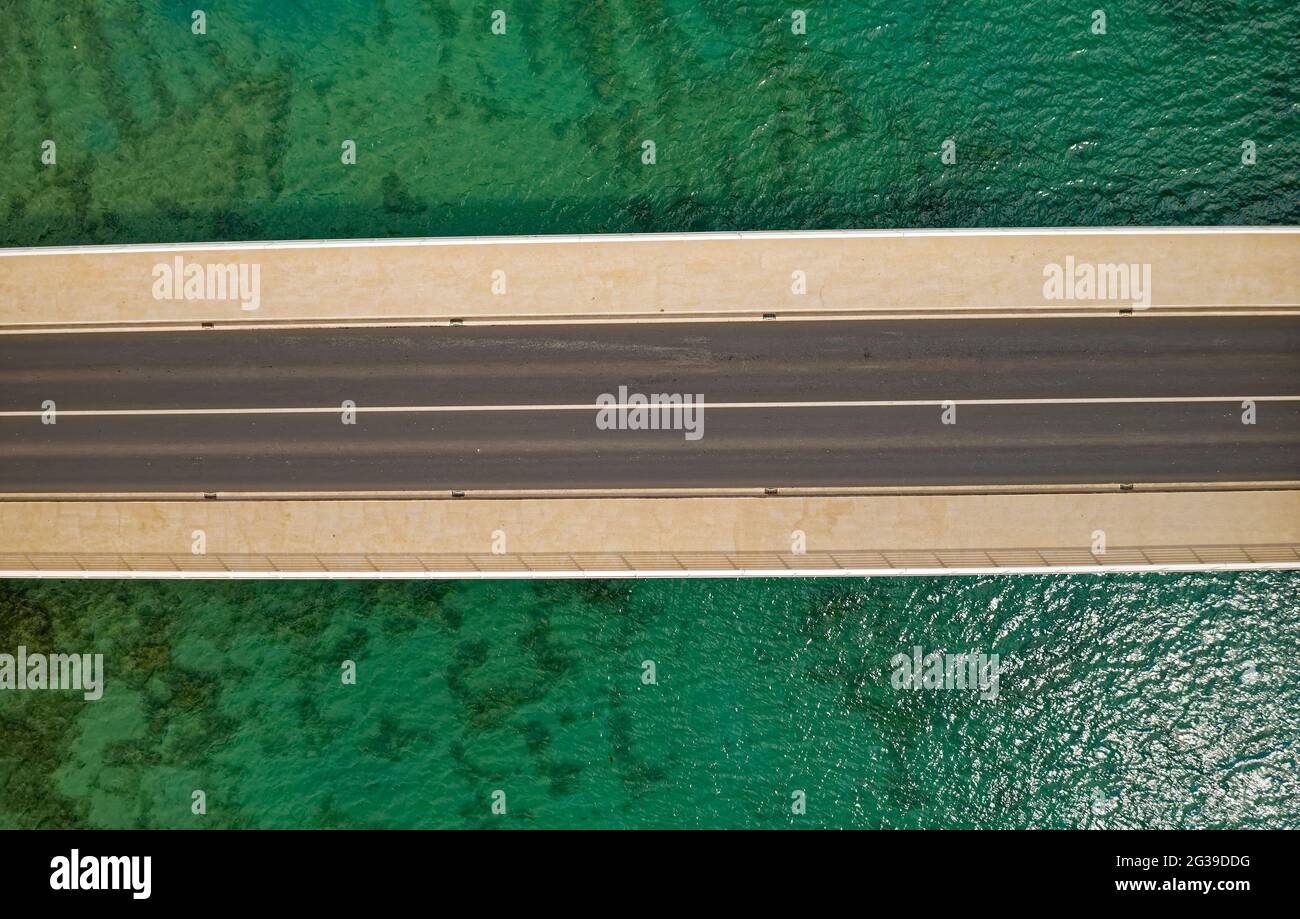 Aerial top view of a long bridge above a sea Stock Photo - Alamy