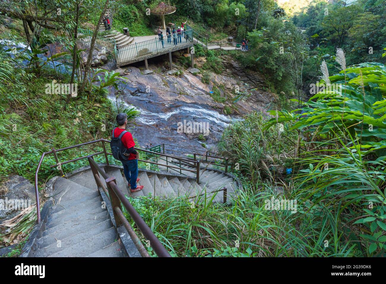 A tourist walking down the steps at Thac Bac waterfall, Sapa, Vietnam ...