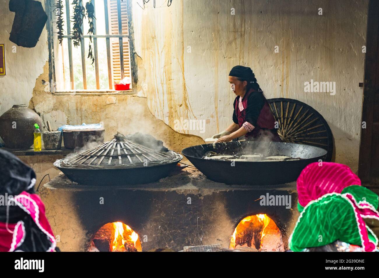 Woman cooking over pot hi-res stock photography and images - Alamy
