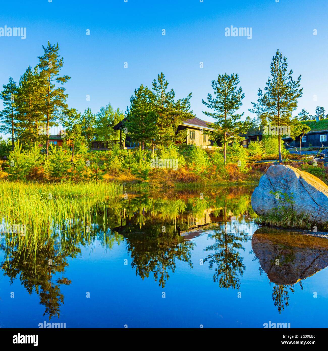 Morning sunrise with reflection in lake river in nature landscape of ...
