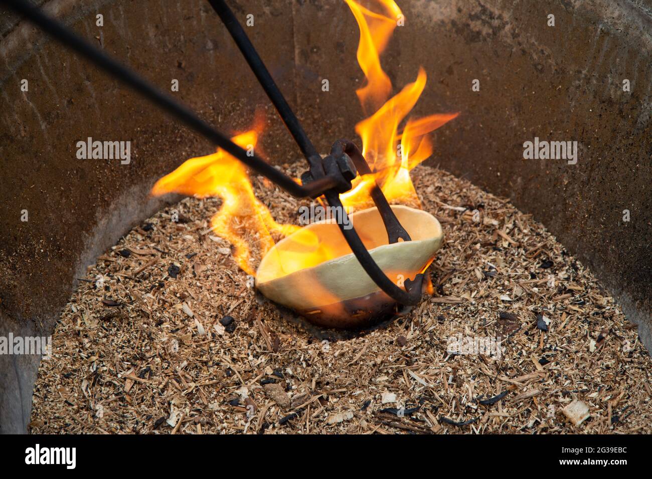 When creating traditional Japanese Raku ware, red hot pottery pieces ...