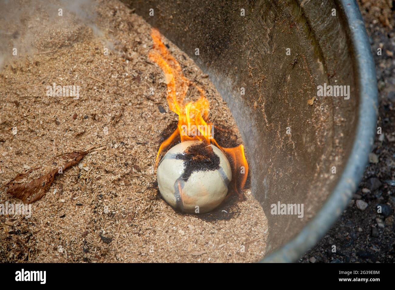 When creating traditional Japanese Raku ware, red hot pottery pieces ...