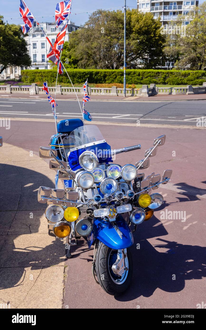 Vintage Lambretta scooter with multiple headlamps parked on the ...
