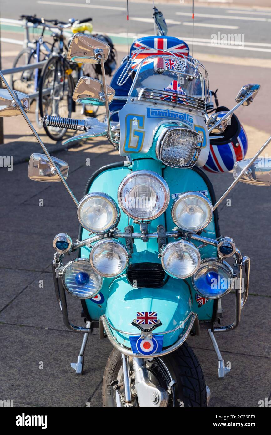 Vintage Lambretta scooter with multiple headlamps parked on the ...