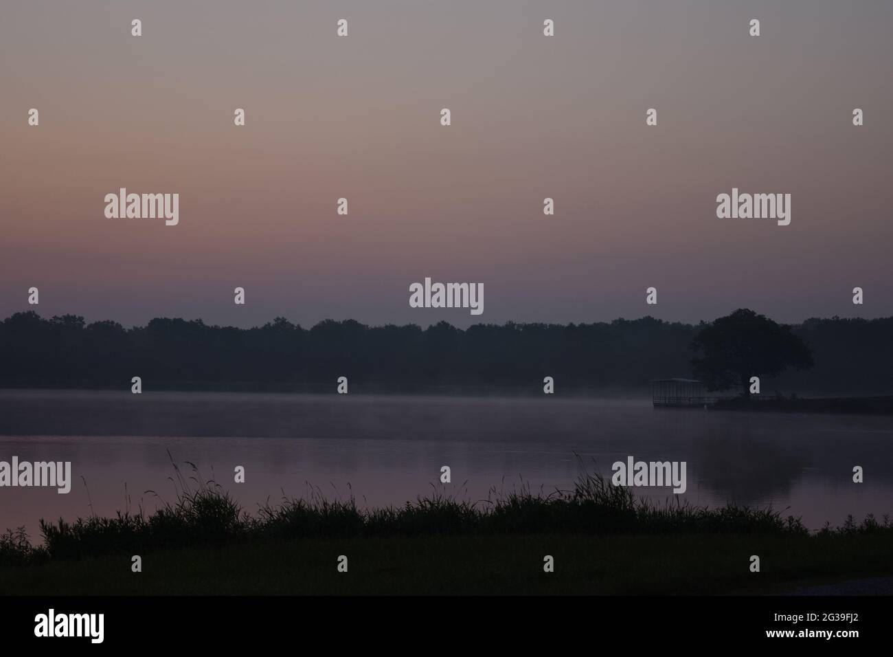Summer sunrise over lake with dock hi-res stock photography and images ...