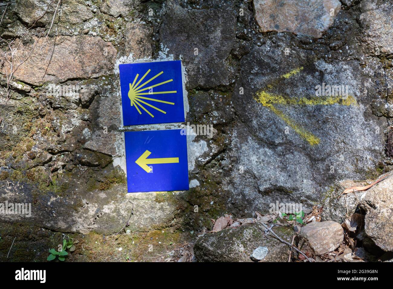 Camino de Santiago sign tiles on stone wall Stock Photo - Alamy