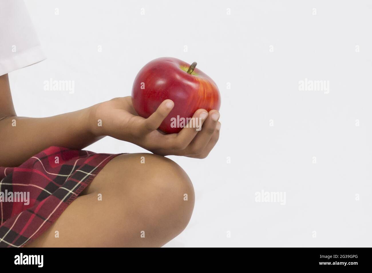 hand with apple on white background Stock Photo - Alamy