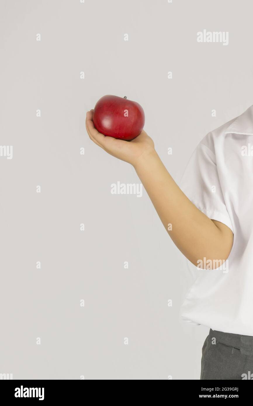 hand with apple on white background Stock Photo - Alamy