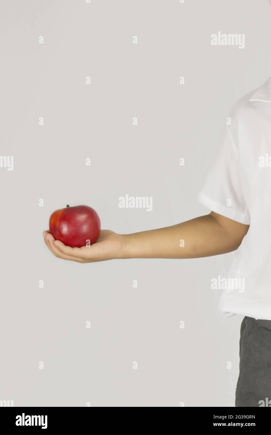 hand with apple on white background Stock Photo - Alamy