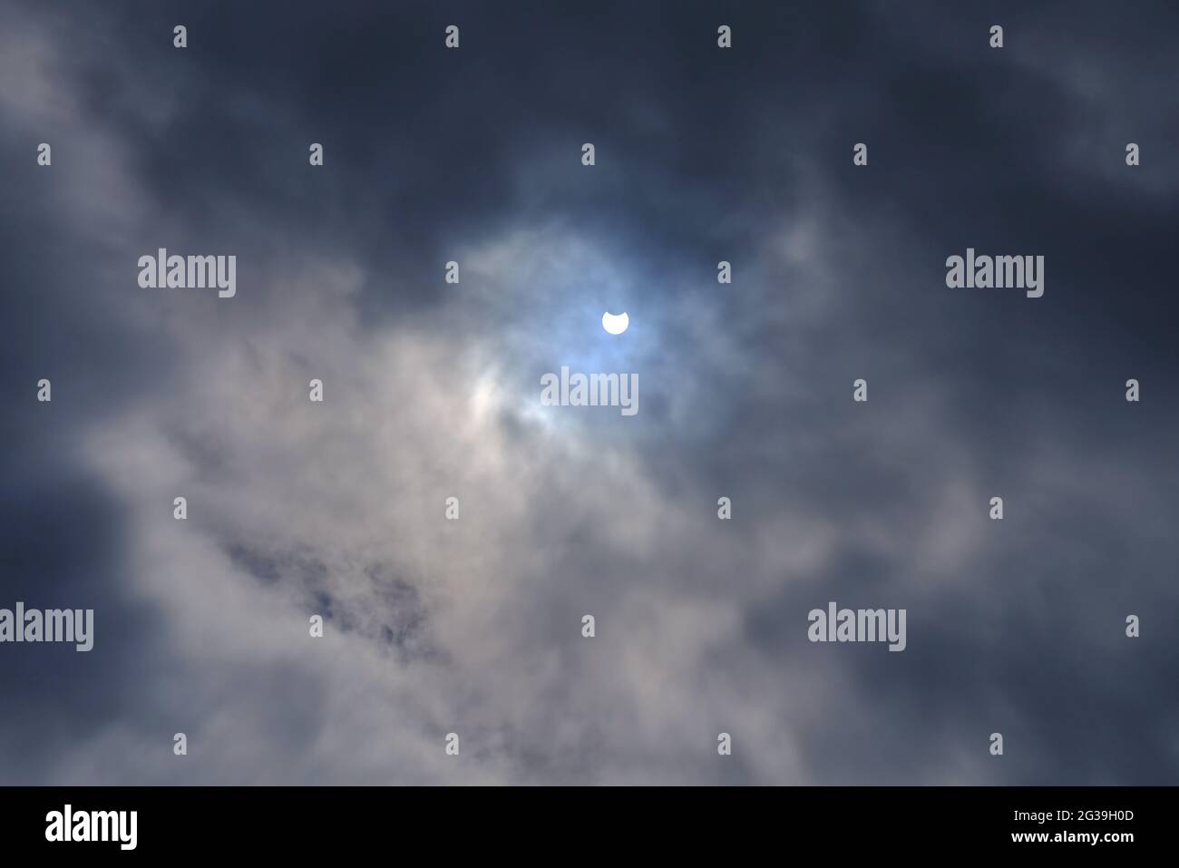 London, UK. A solar eclipse occured as seen in Westminster. Heavy cloud ...