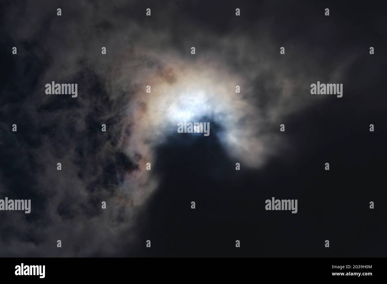 London, UK. A solar eclipse occured as seen in Westminster. Heavy cloud ...