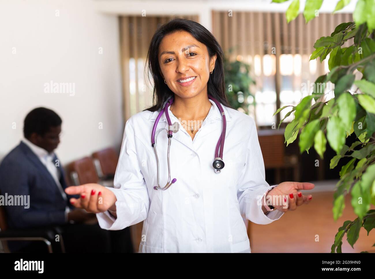 Female doctor posing in clinic Stock Photo - Alamy