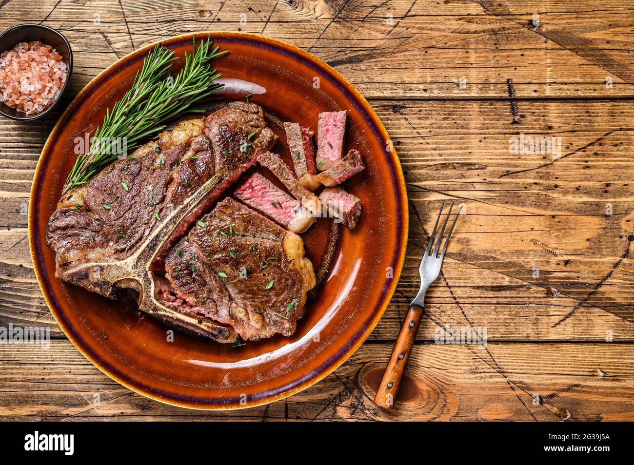 Barbecue Roast porterhouse or t bone beef meat Steak on a rustic plate ...