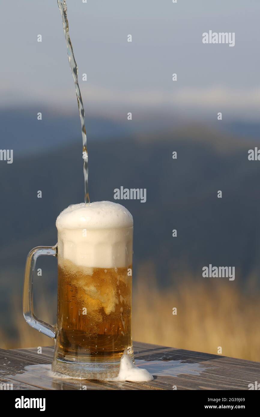 Pouring lager beer Stock Photo - Alamy