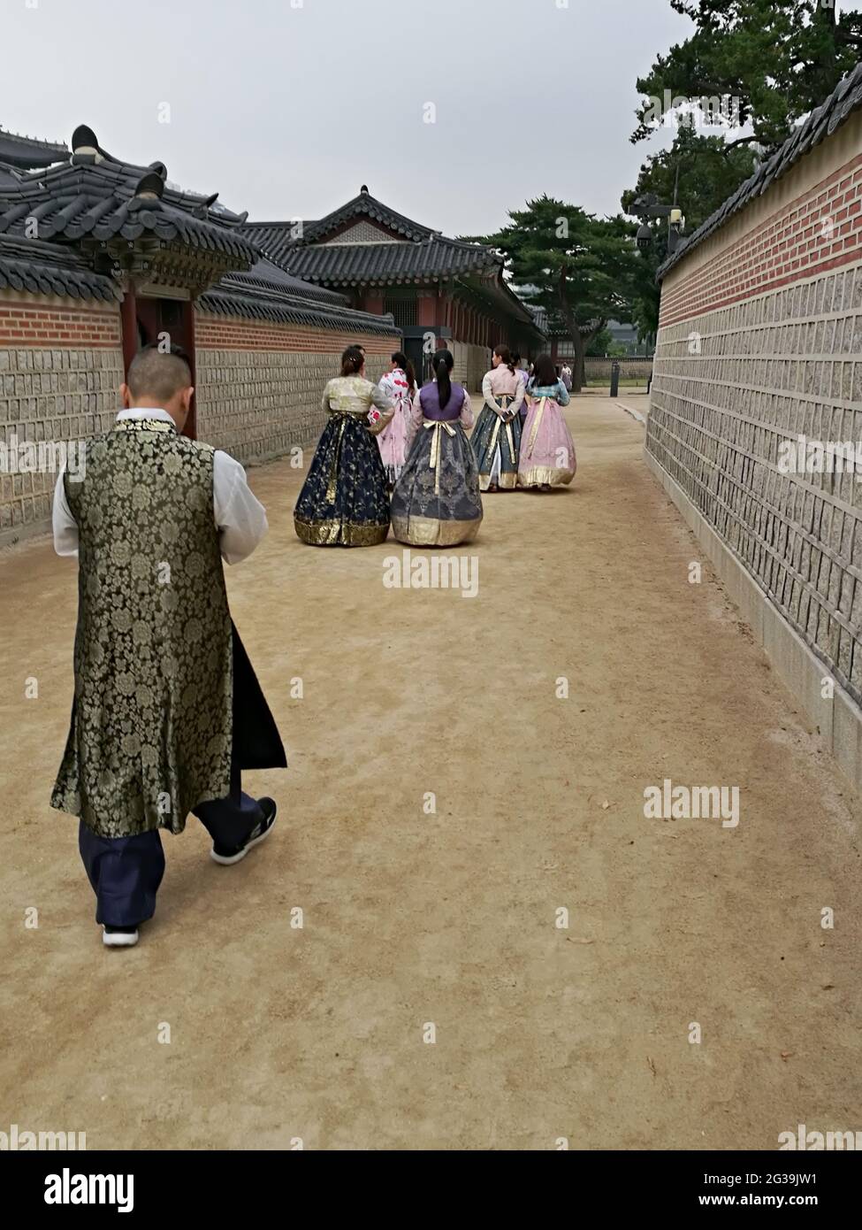 SEOUL, KOREA, SOUTH - Jun 29, 2019: Group of walking people in between ...