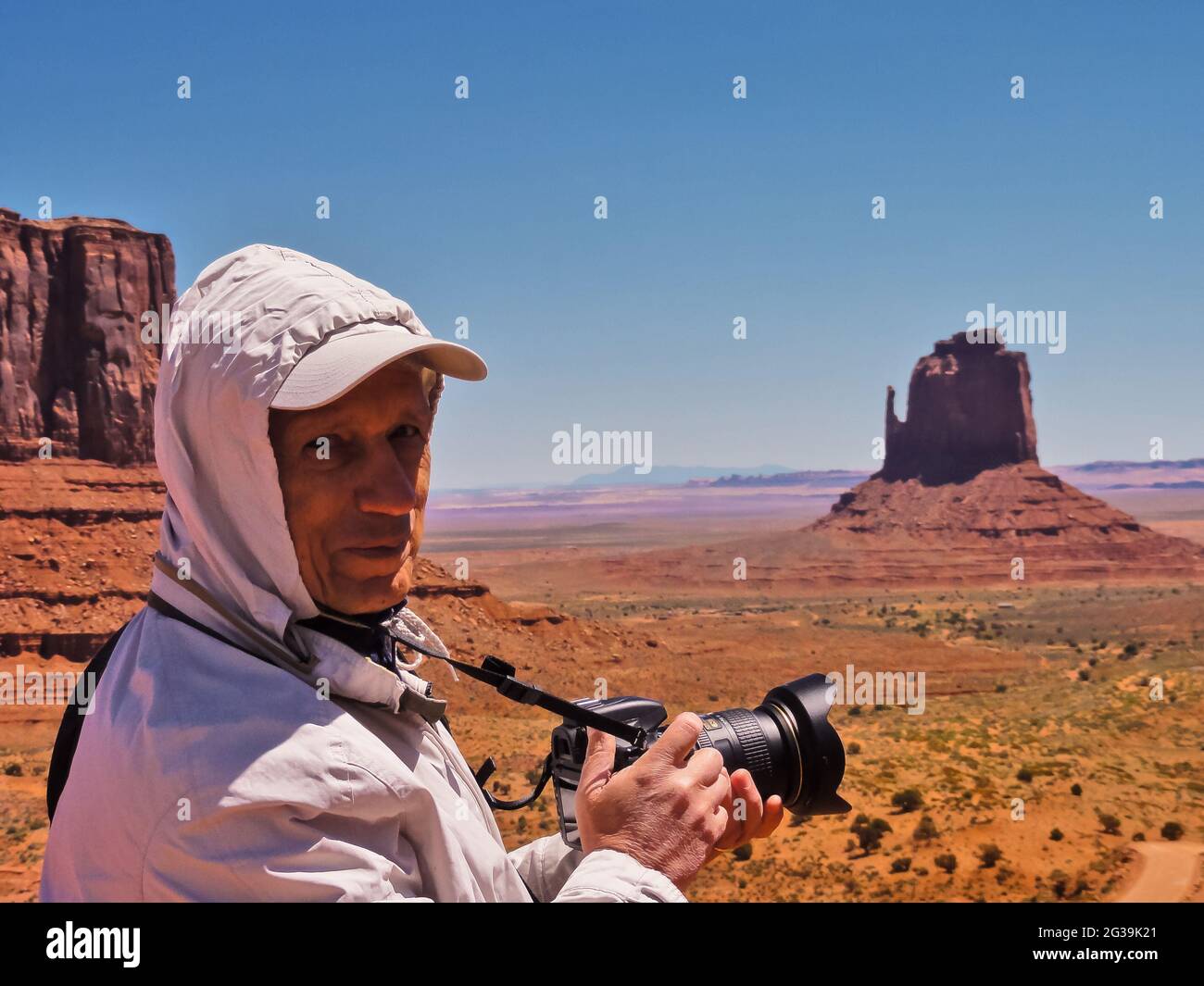 A tourist in protective clothing from the bright sun and sandstorm ...
