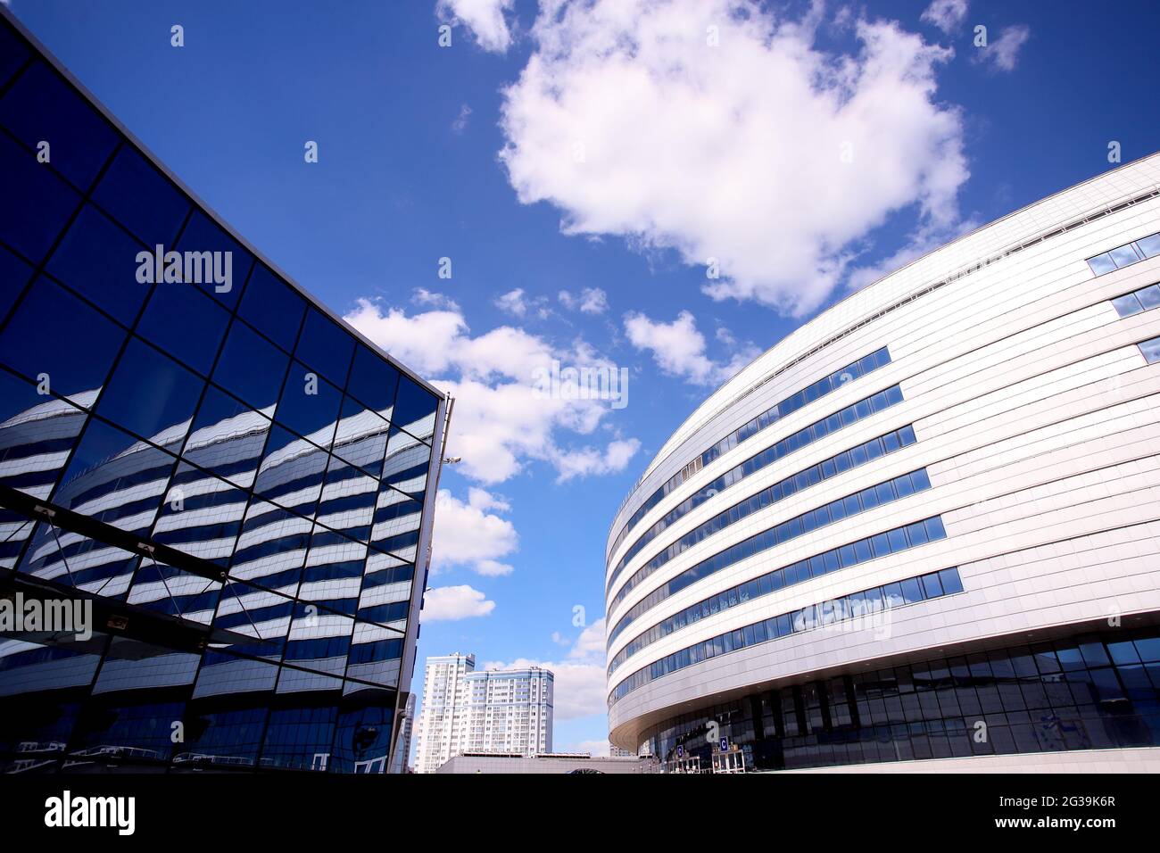 The new building of the sports complex against the blue sky. Glass ...