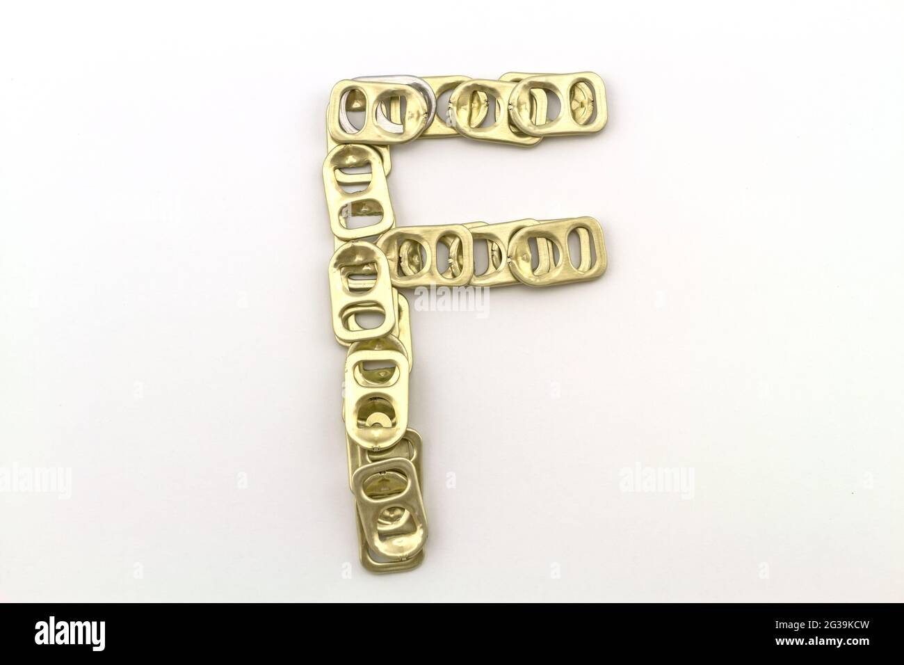 Alphabet of F stack from ring pull aluminum of cans on white background ...