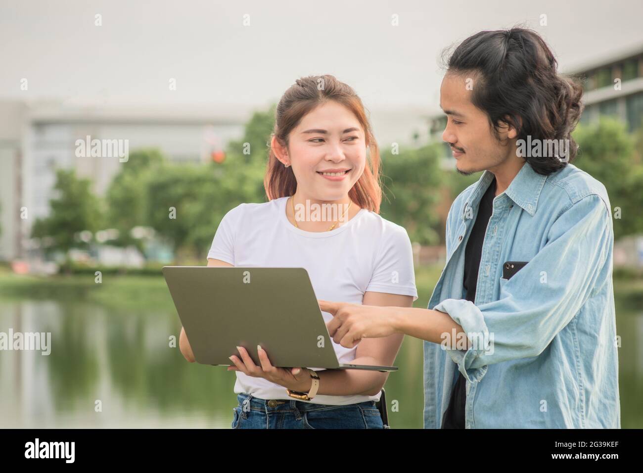 Man and woman using computer business technology outdoor Stock Photo ...