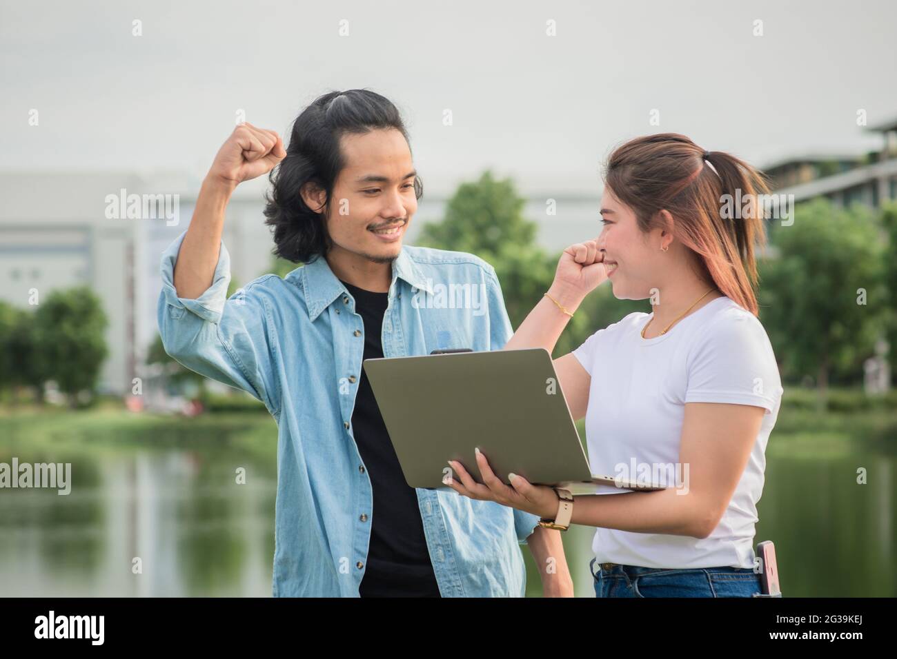 Man and woman using computer business technology outdoor Stock Photo ...