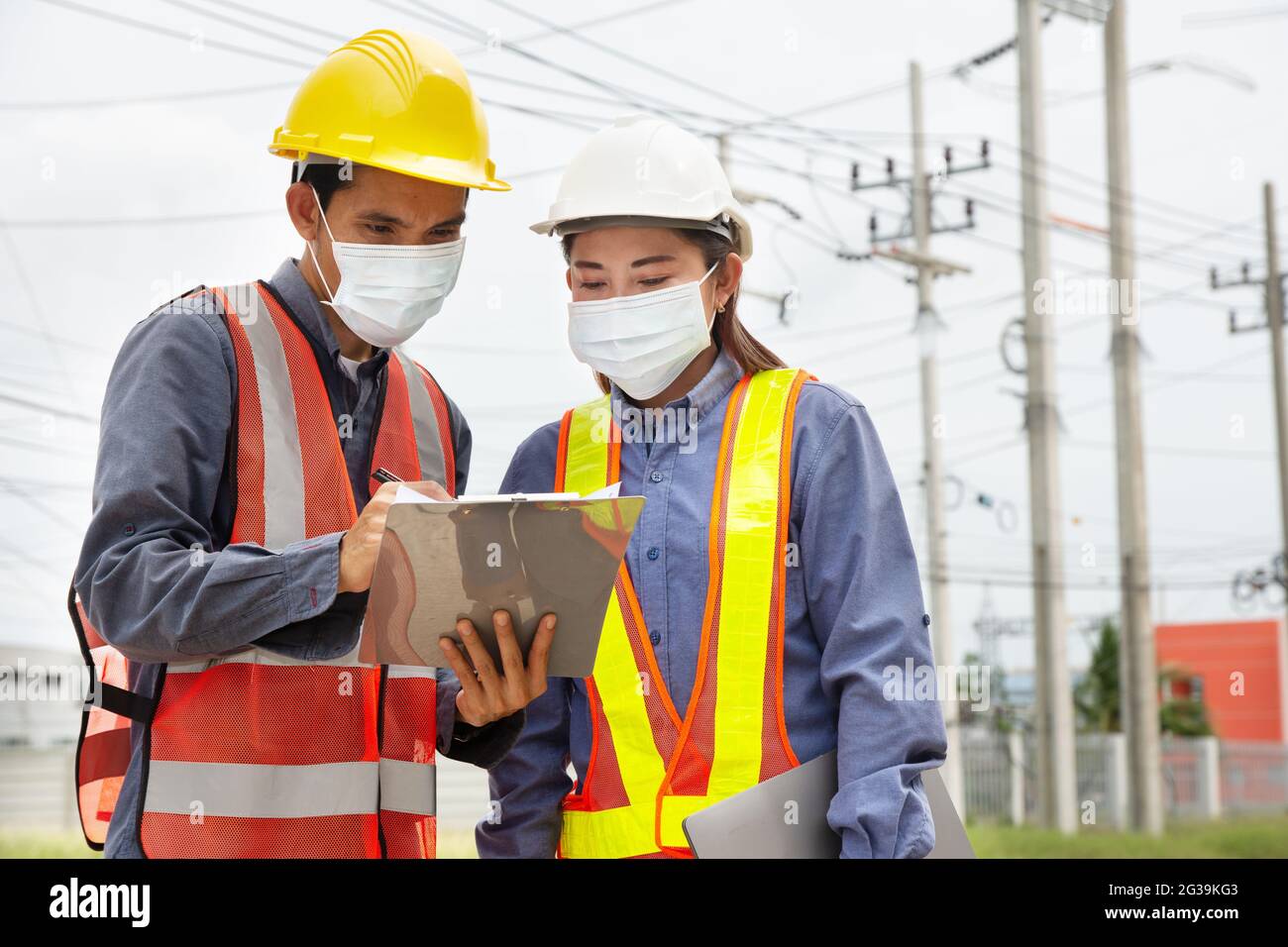 Two Engineer teamwork wear face mask protect coronavirus covid19 Stock ...