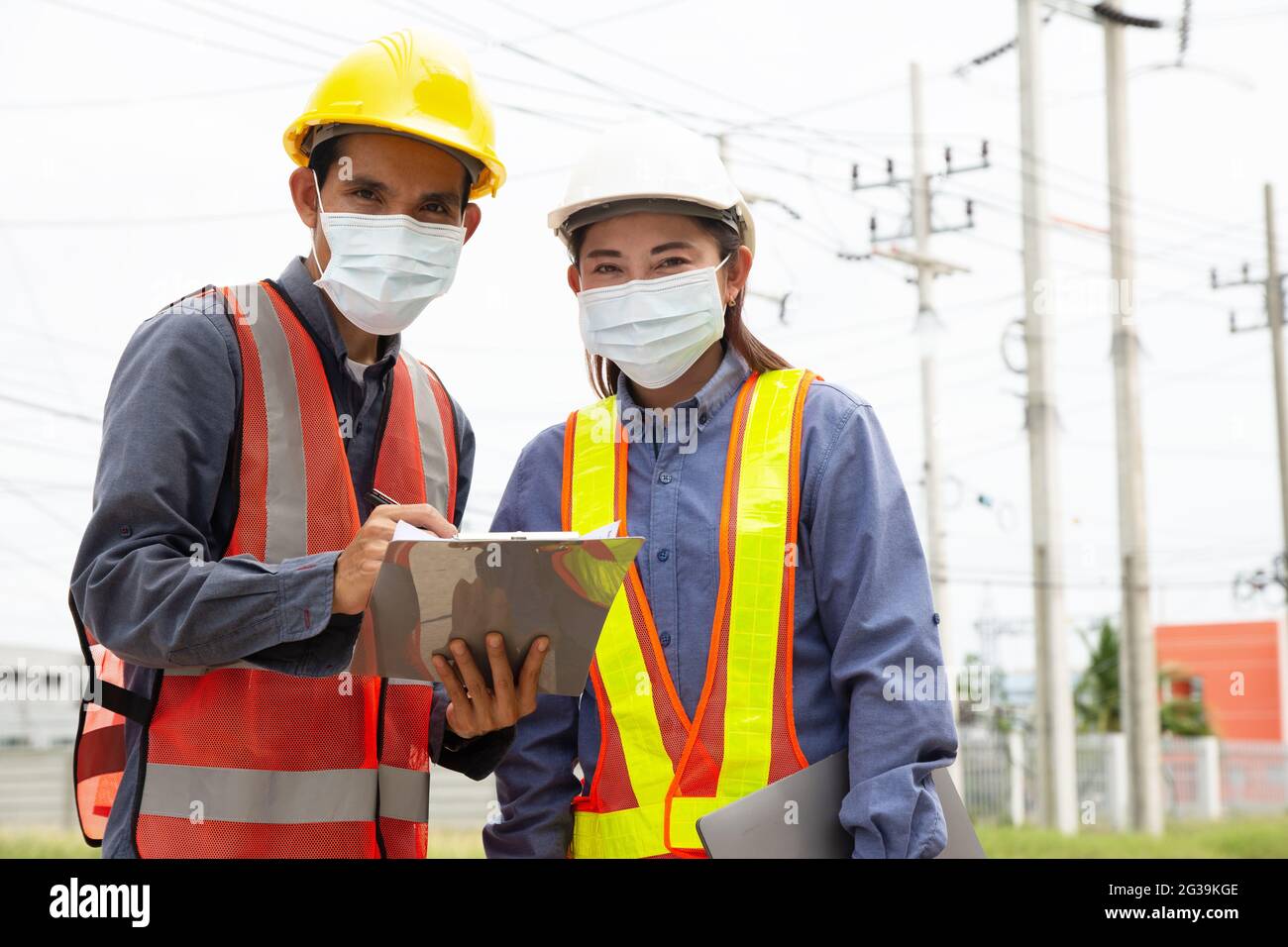 Two Engineer teamwork wear face mask protect coronavirus covid19 Stock ...