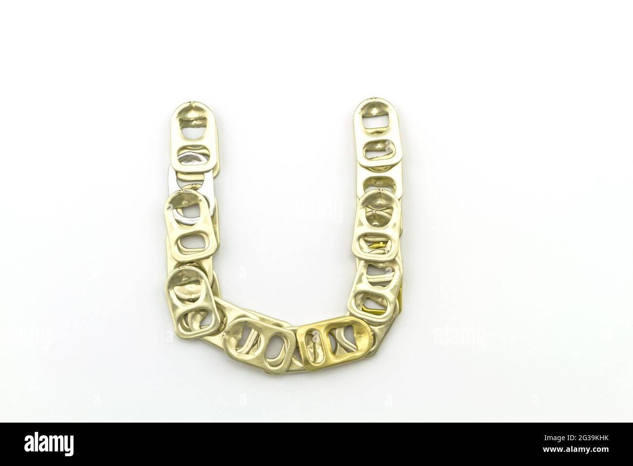 Alphabet of U stack from ring pull aluminum of cans on white background ...