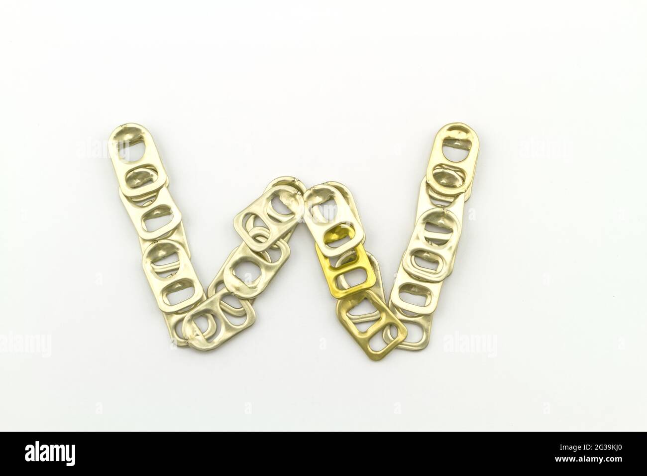 Alphabet of W stack from ring pull aluminum of cans on white background ...