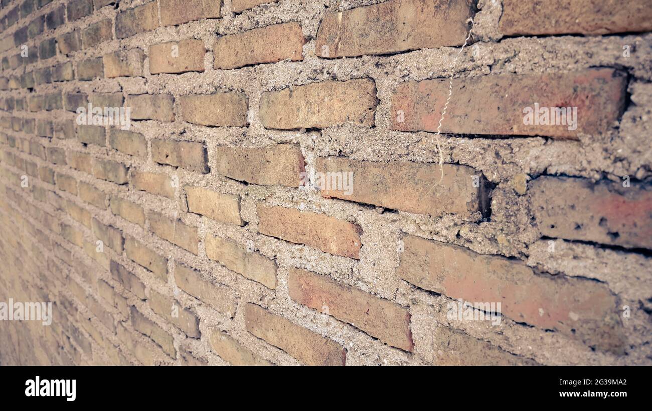 Side view of old orange vintage brick wall background Stock Photo - Alamy