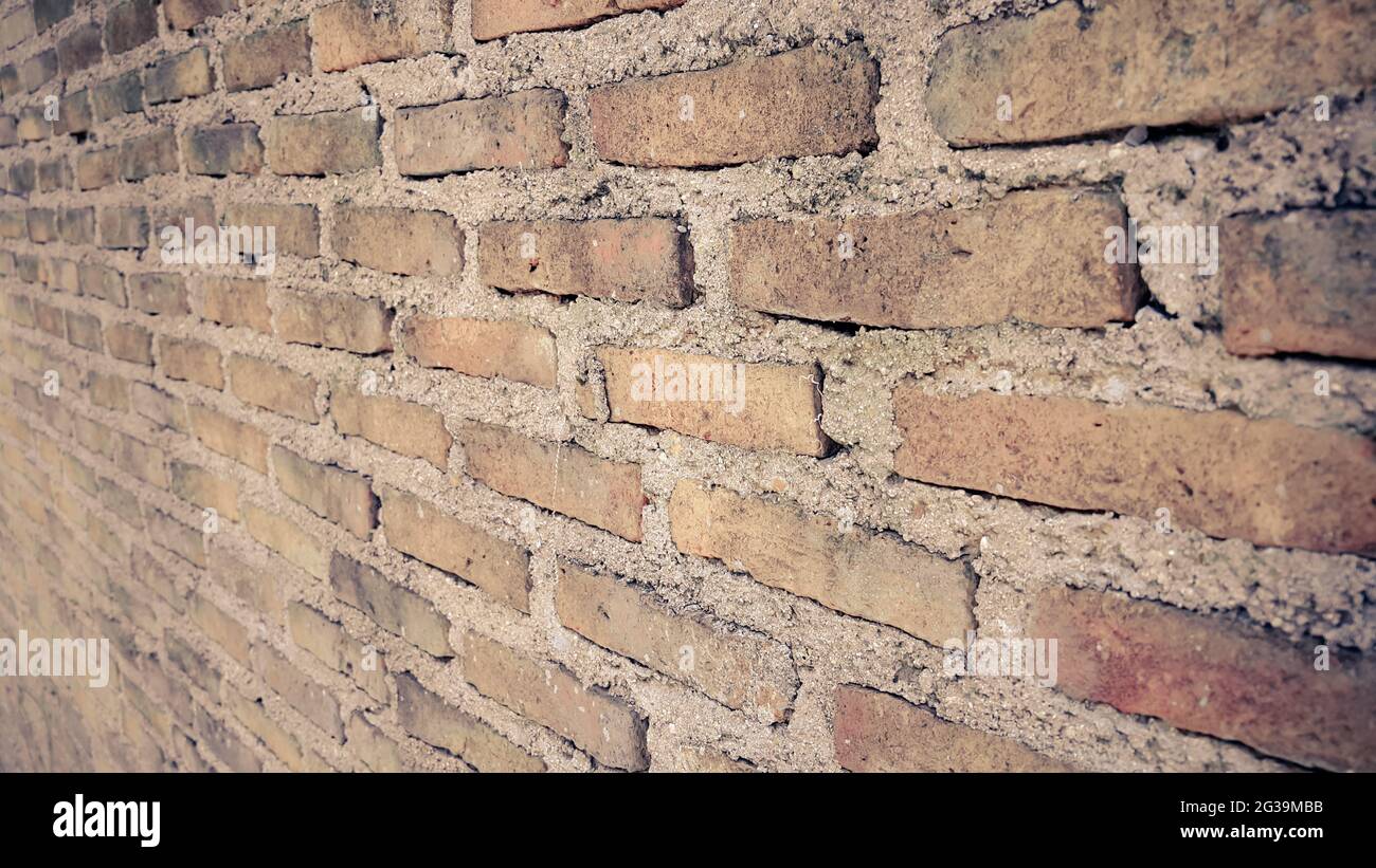 Side view of old orange vintage brick wall background Stock Photo - Alamy
