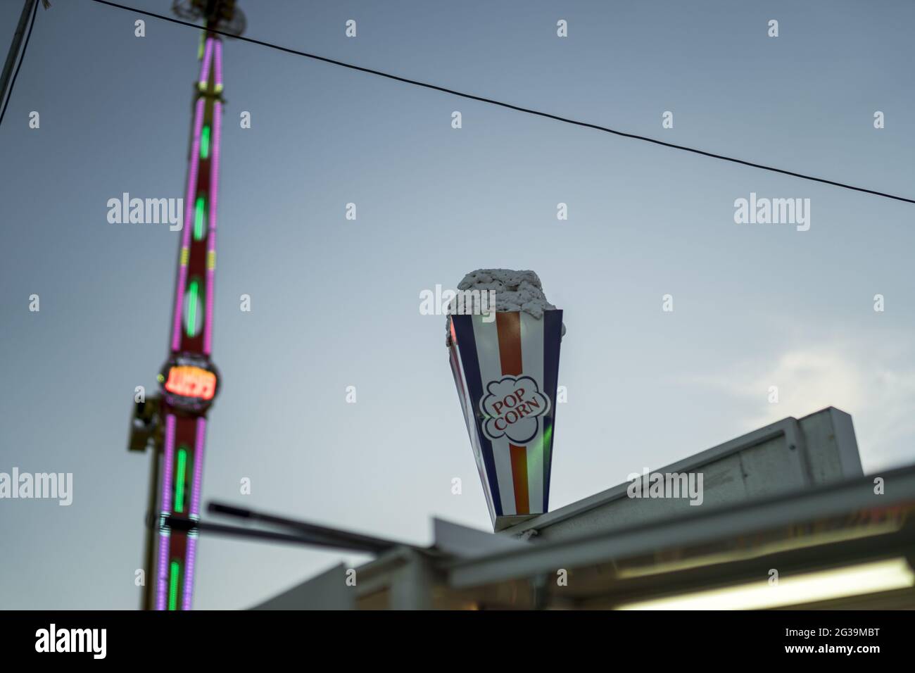 Low angle shot of a huge popcorn sign in the amusement park Stock Photo ...
