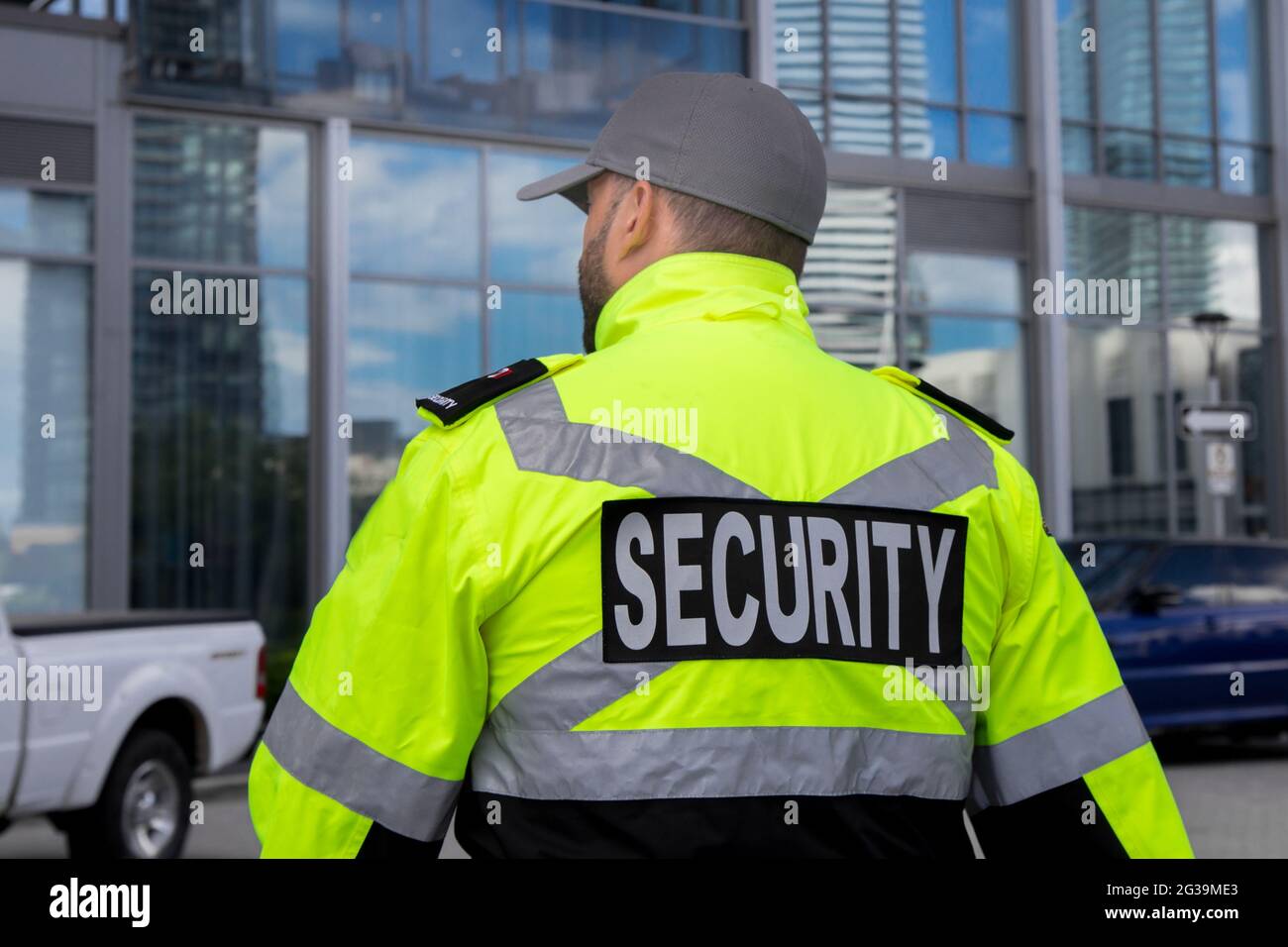 Security guard in uniform patrolling a residential area Stock Photo - Alamy