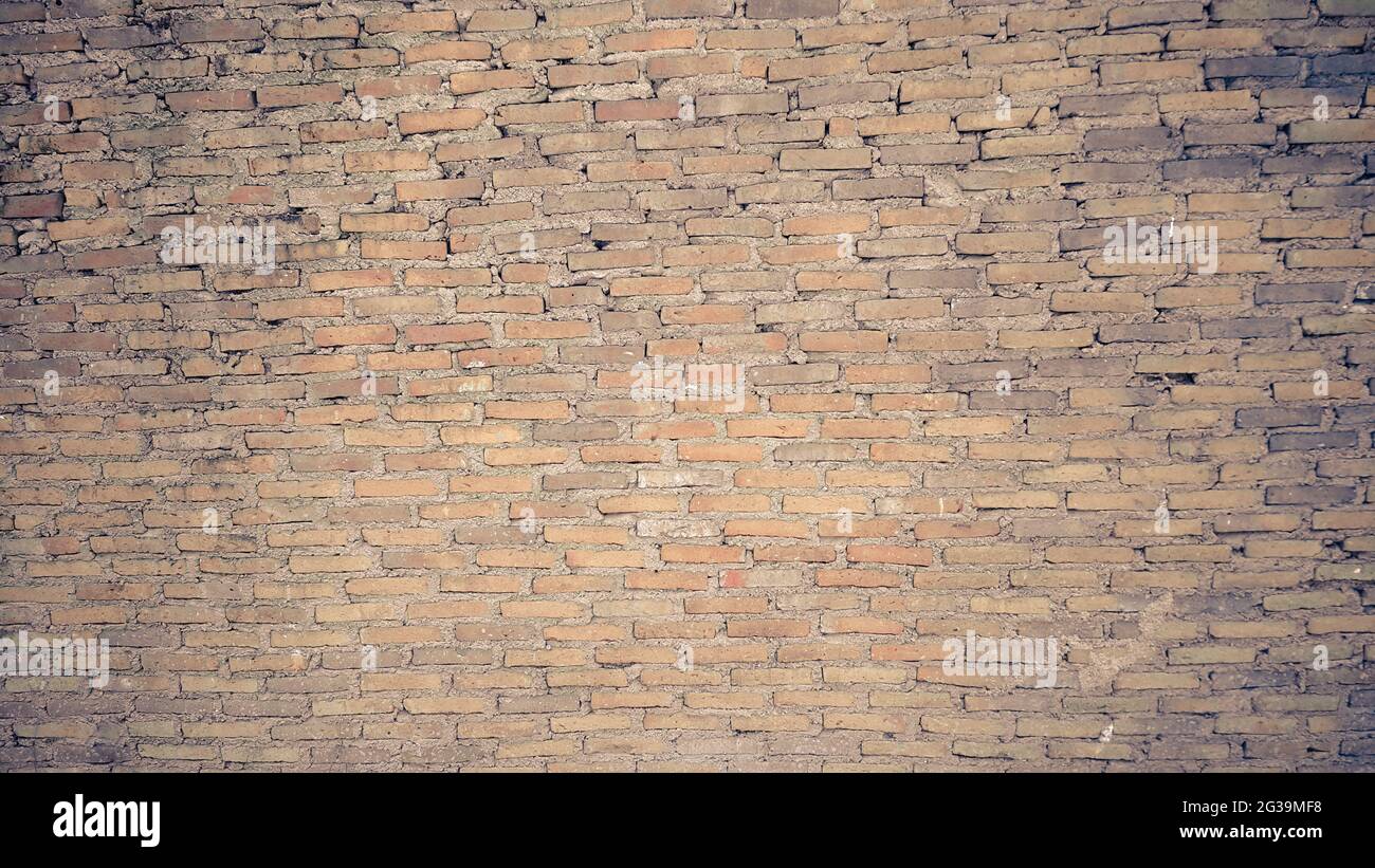 Side view of old orange vintage brick wall background Stock Photo - Alamy