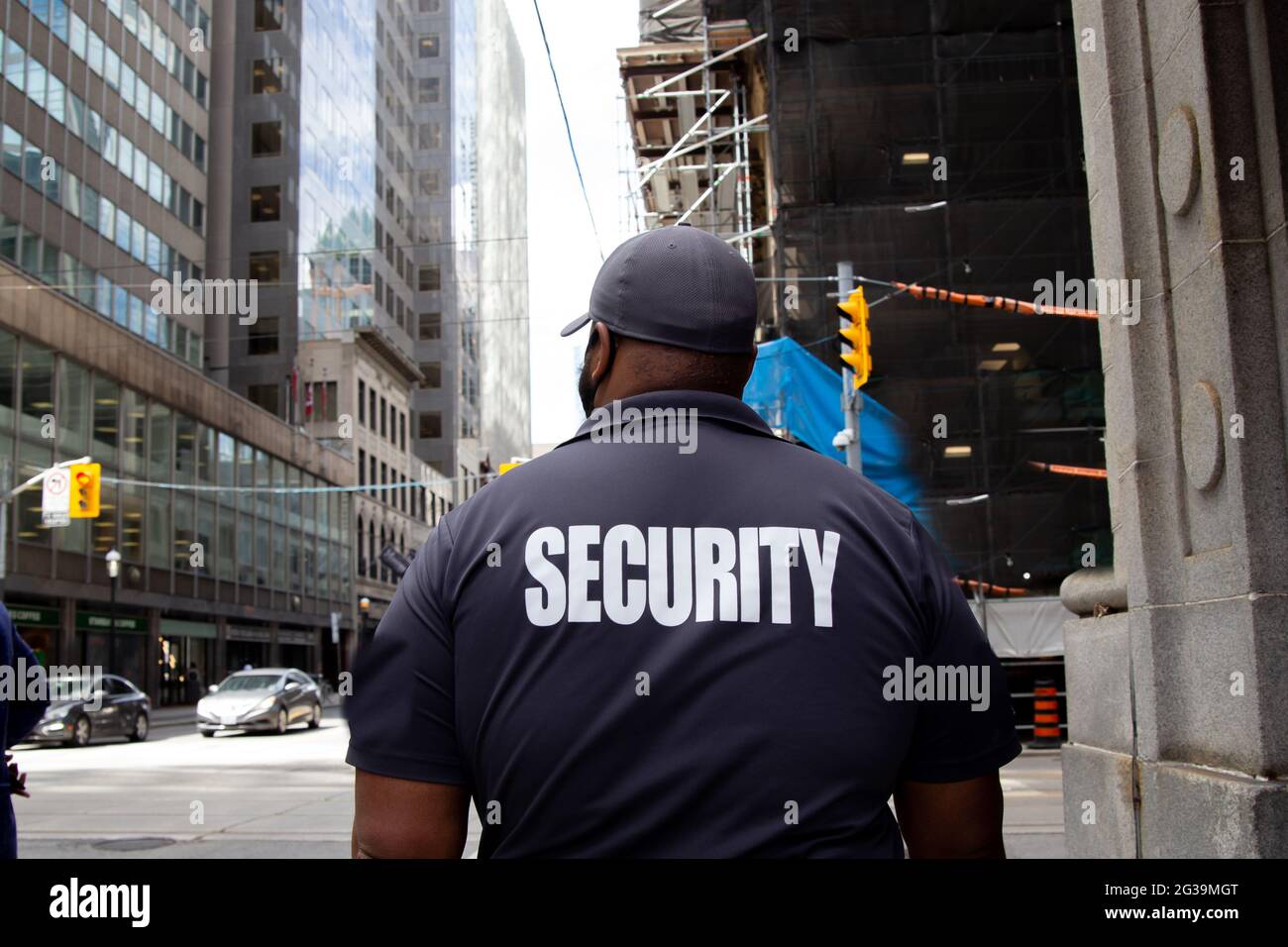Security guard in uniform patrolling a residential area Stock Photo - Alamy