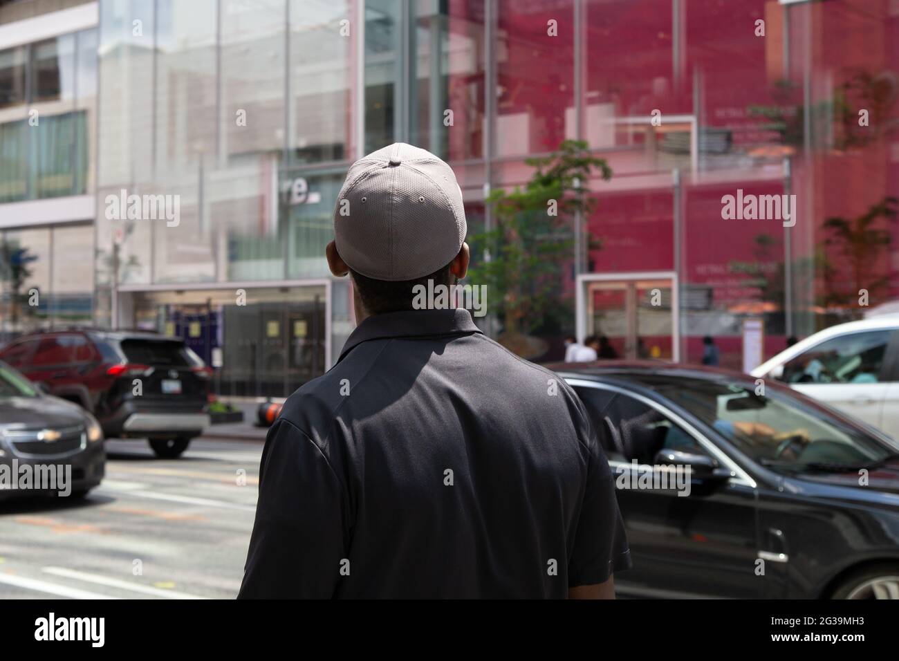 Security guard in uniform patrolling a residential area Stock Photo - Alamy