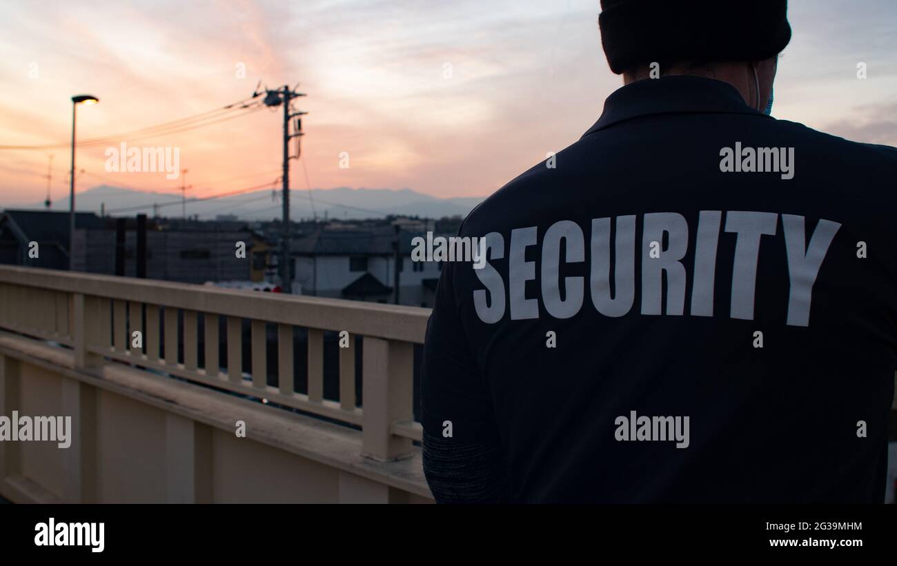 Security guard looking down street hi-res stock photography and images ...