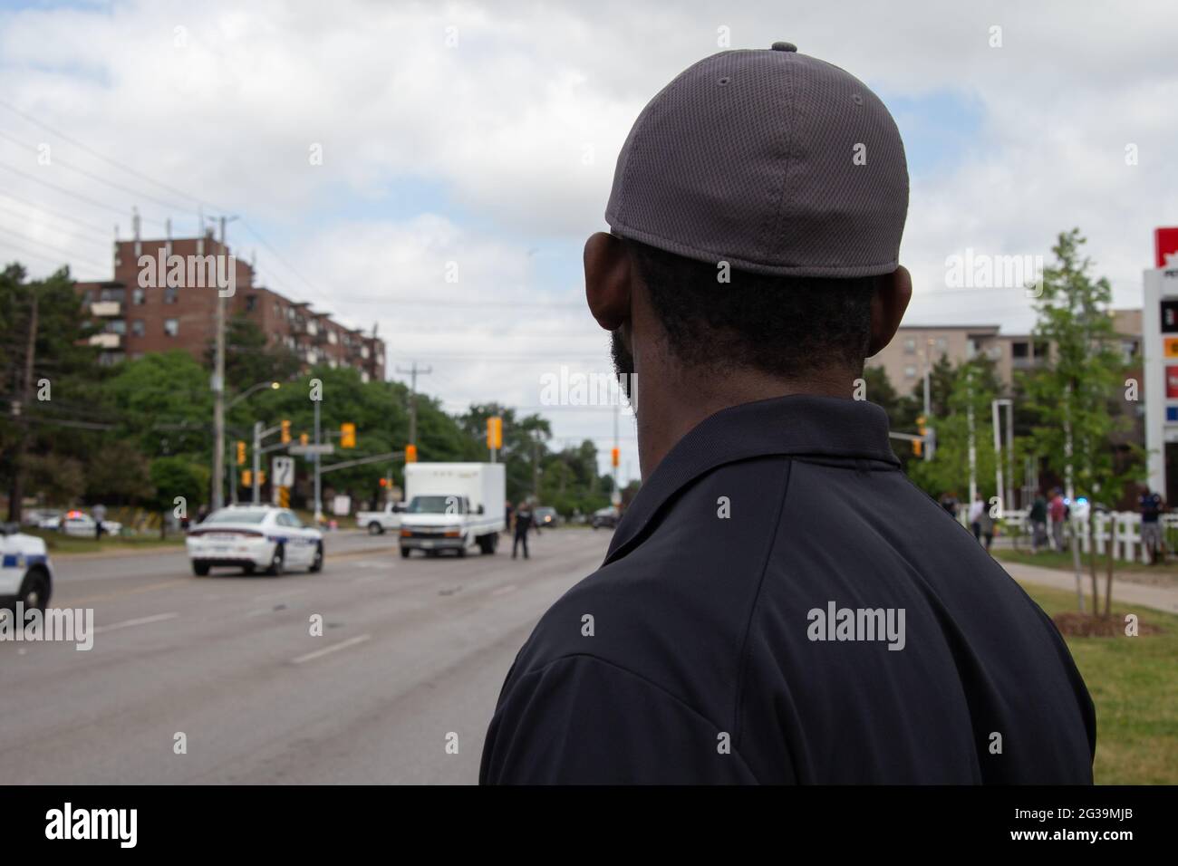 Security guard in uniform patrolling a residential area Stock Photo - Alamy