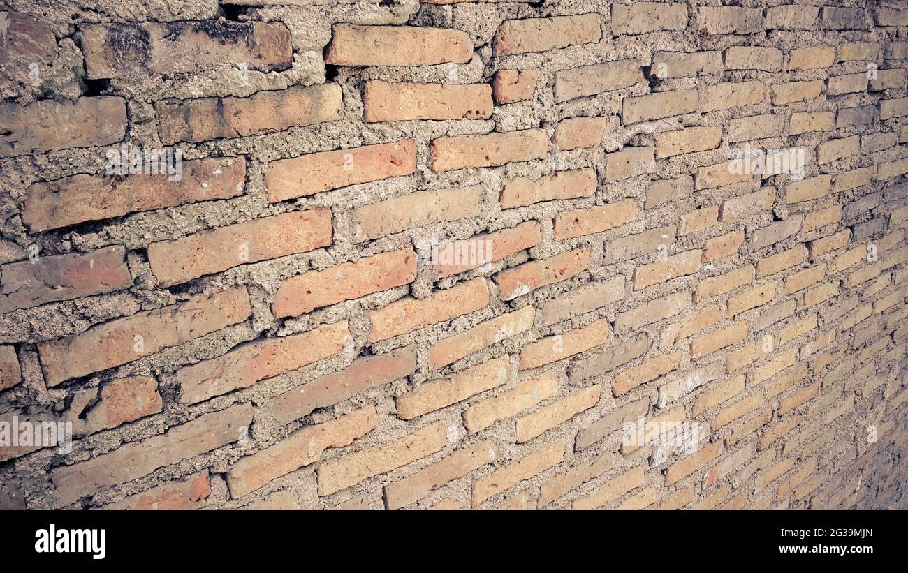Side view of old orange vintage brick wall background Stock Photo - Alamy