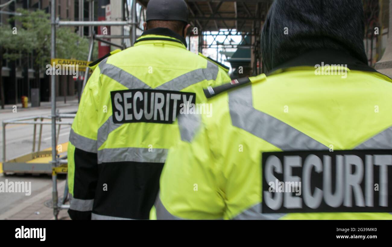 Security guard in uniform patrolling a residential area Stock Photo - Alamy